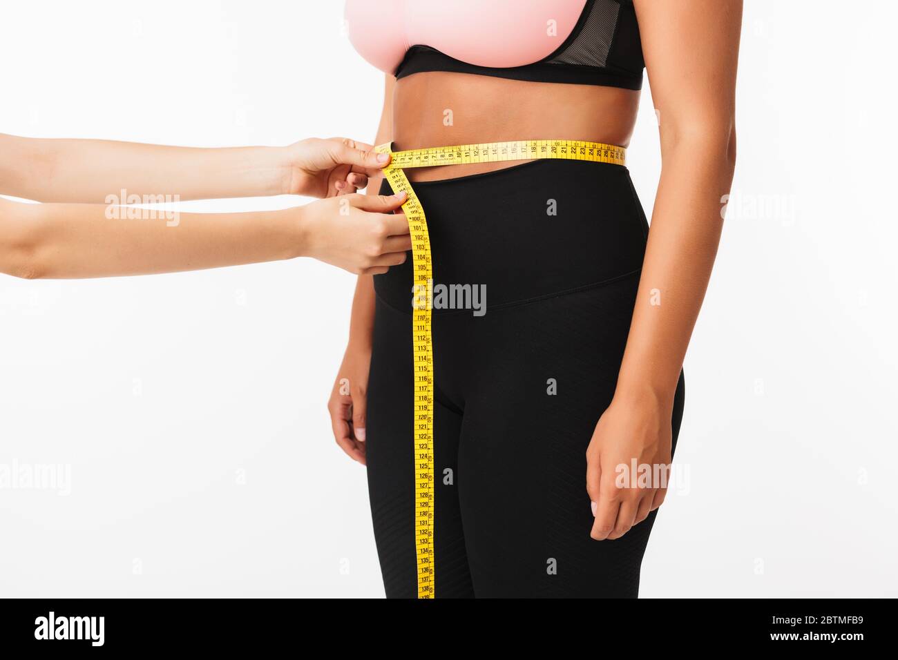 Caucasian female measuring waistline hi-res stock photography and ...