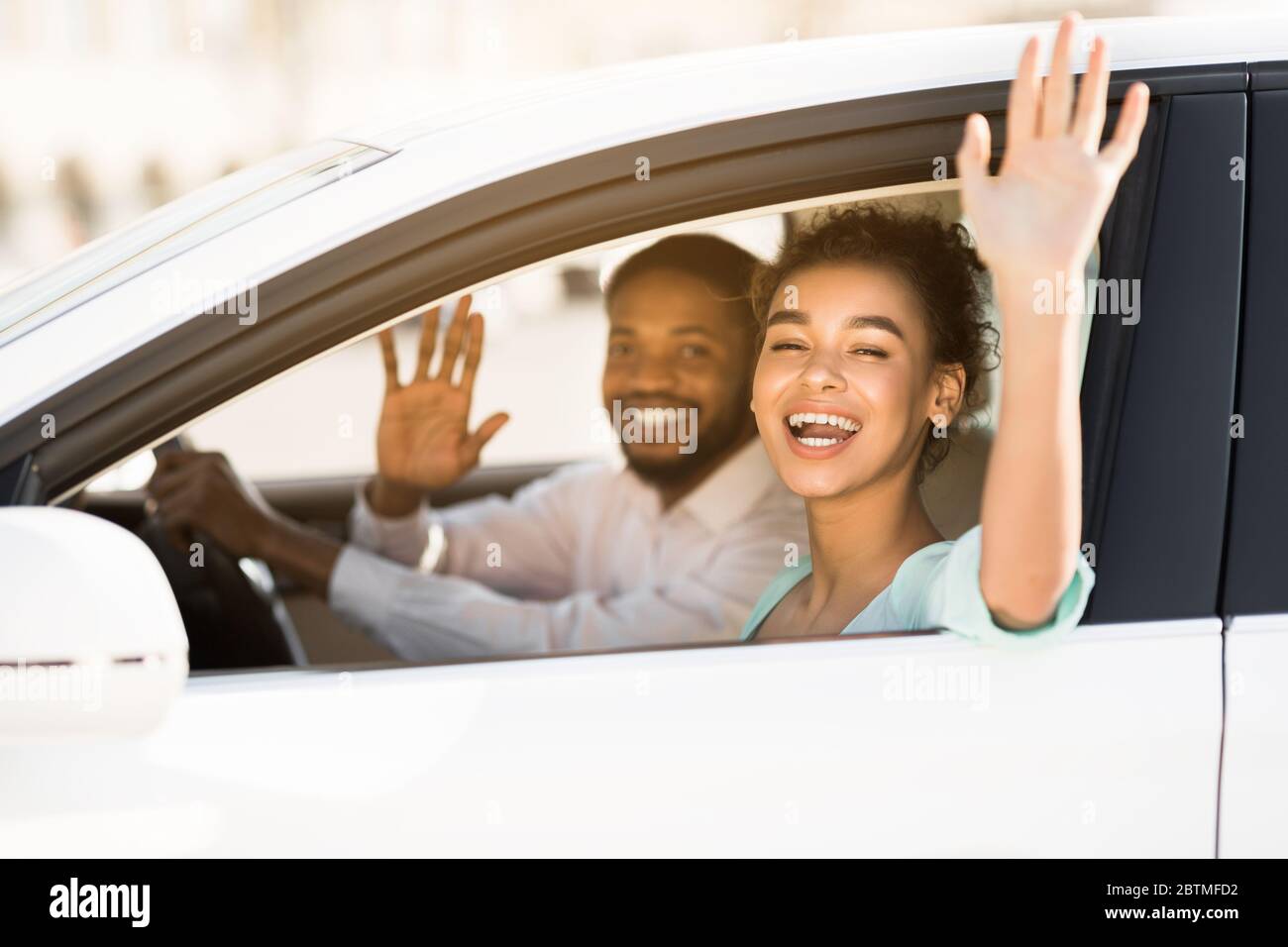 Woman and driver waving hi-res stock photography and images - Alamy