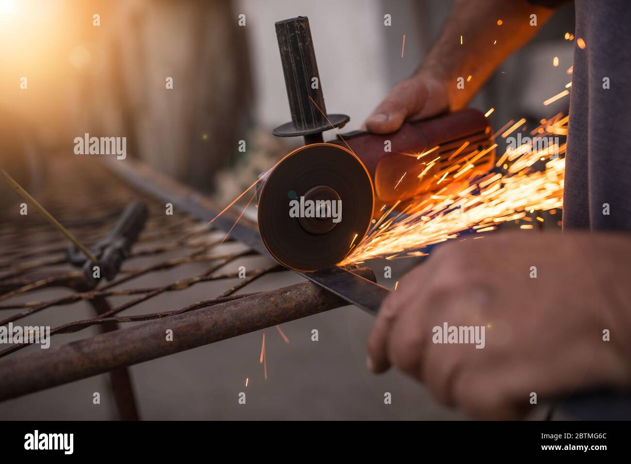 Craftsman metal worker cutting piece hi-res stock photography and ...