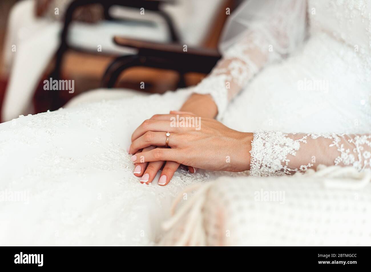 Bride with hands on lap hi-res stock photography and images - Alamy