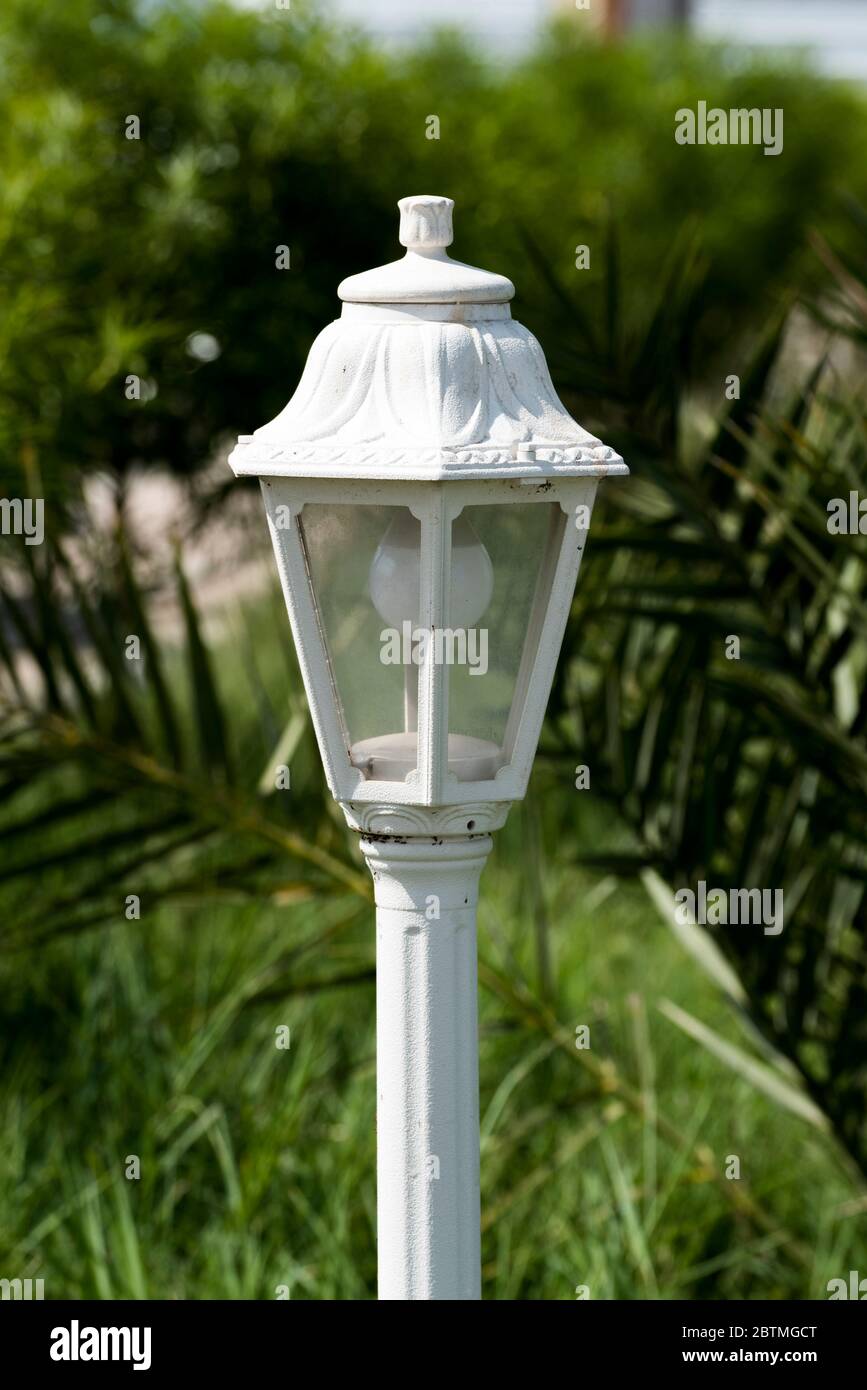 Lamp post in the garden Stock Photo - Alamy