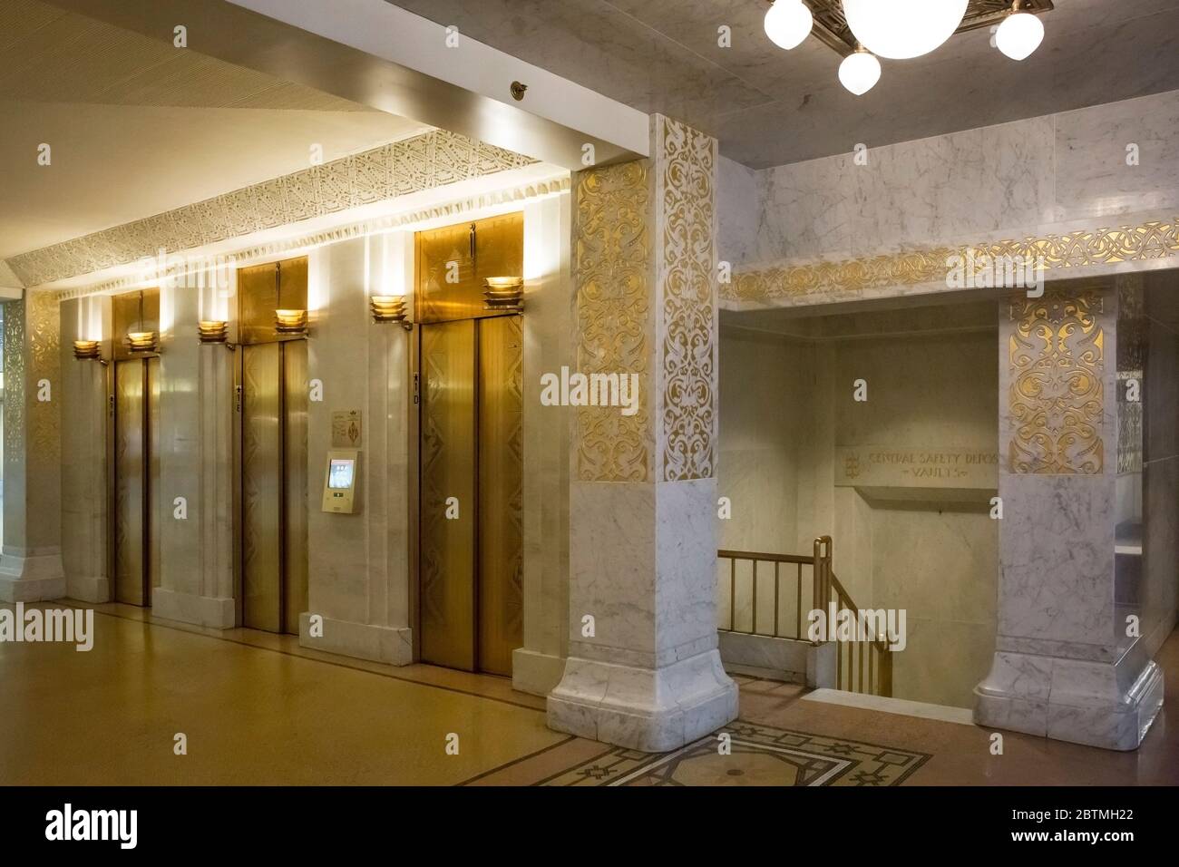 Horizontal view of the gold elevators and elegant decoration of the ...