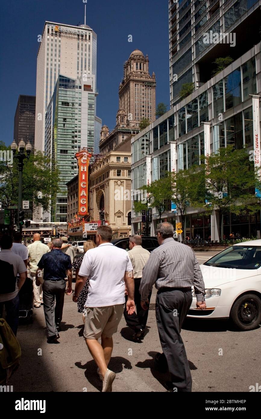 Colorful shot of people with their backs towards on a pedestrian ...