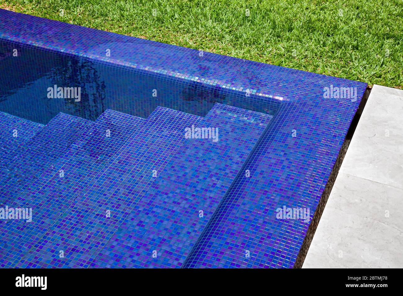 Step pool, lined with small blue tiles Stock Photo - Alamy