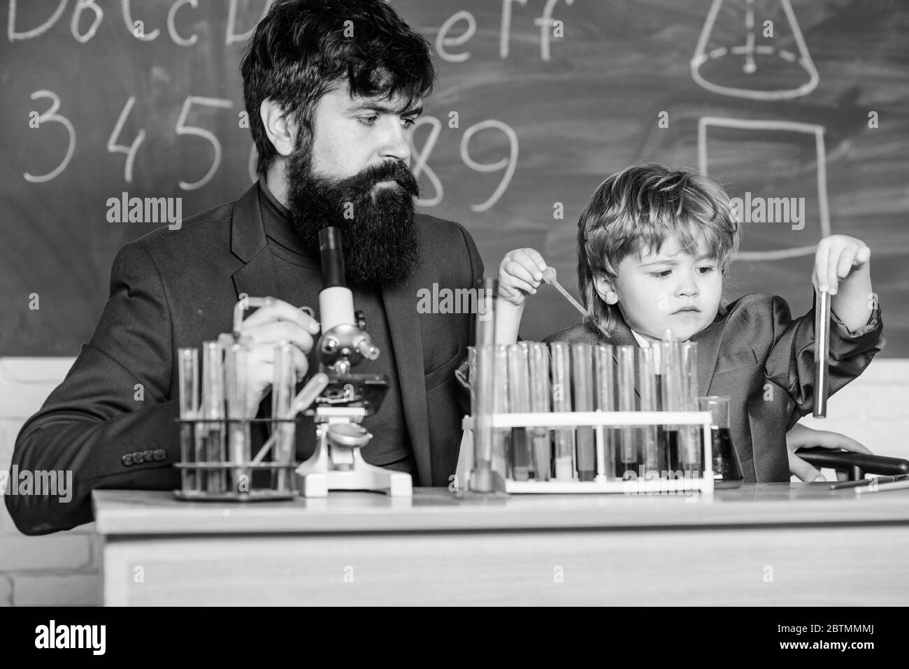 Modern Laboratory. son and father at school. Biologist Conducts ...