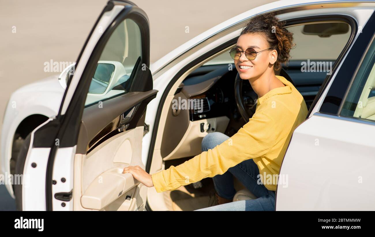 Girl getting out of car hi-res stock photography and images - Alamy