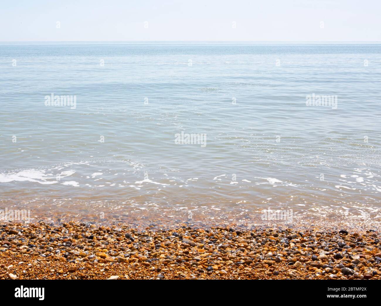 Seascape with pebbles and shoreline Stock Photo - Alamy