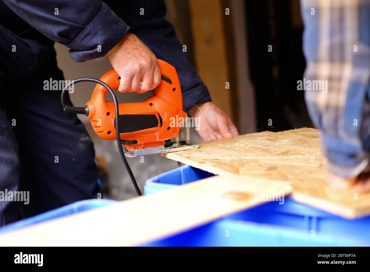 Close up mature carpenter grinding hi-res stock photography and images ...