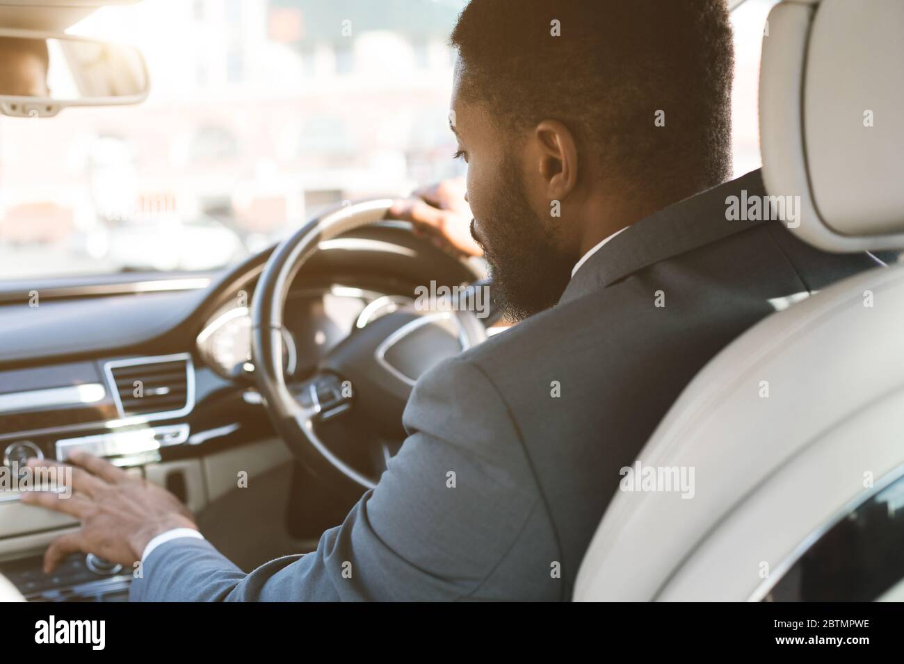 Unrecognizable Driver Man Pushing Buttons Driving Car, Rear View Stock ...