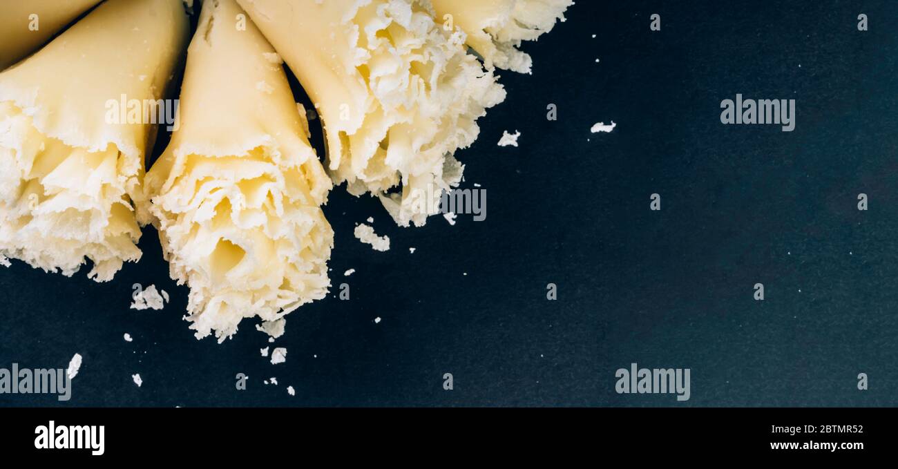 Swiss cheese Tete de Moine or monastery monk's head, scraped with a ...