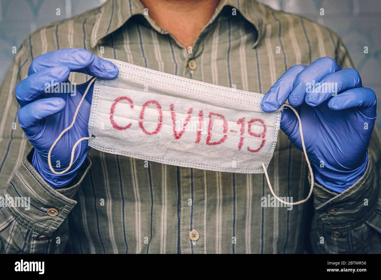 Protective mask in male hands. inscription mask covid-19, Face mask ...