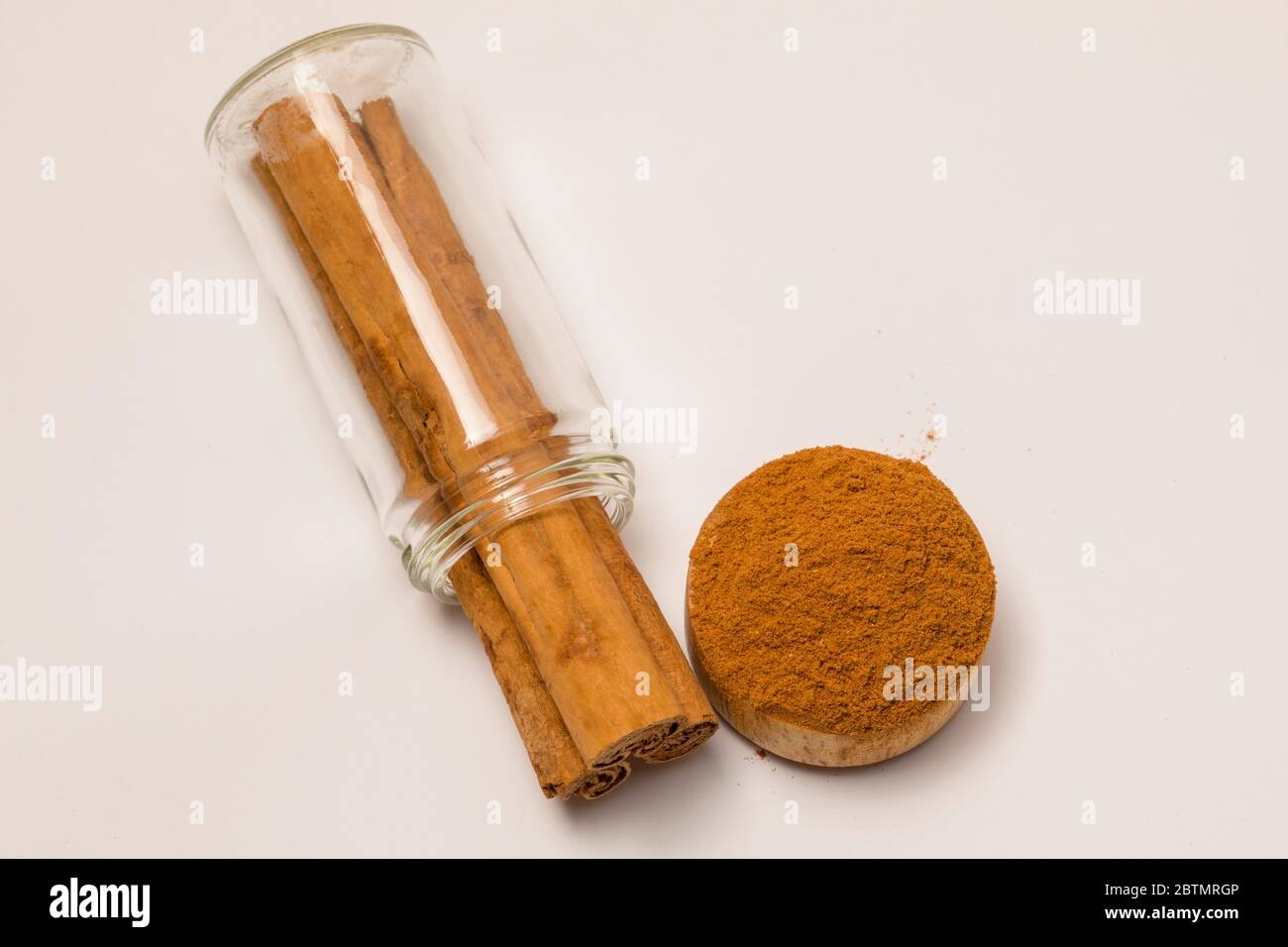 Close-up view of cinnamon sticks and powder on white background Stock ...