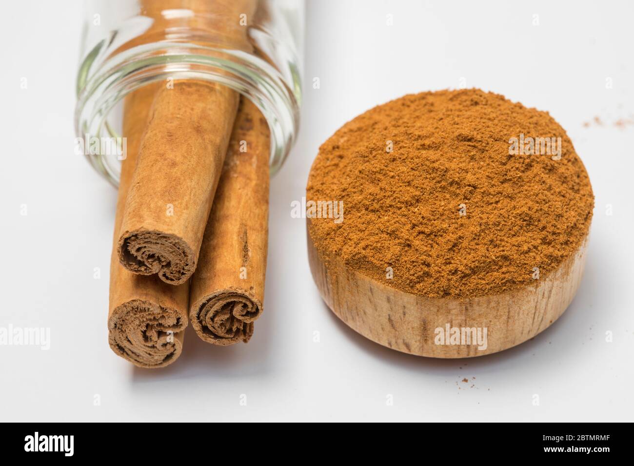 Close-up view of cinnamon sticks and powder on white background Stock ...
