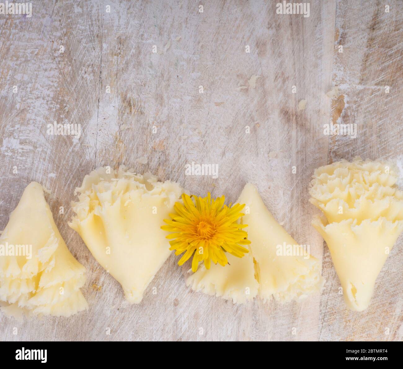 Swiss cheese Tete de Moine or monastery monk's head, scraped with a ...