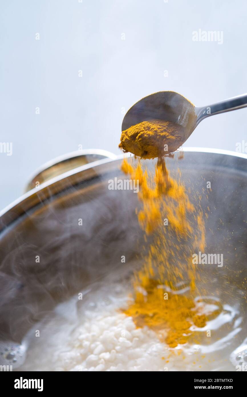 Adding rice hi-res stock photography and images - Alamy
