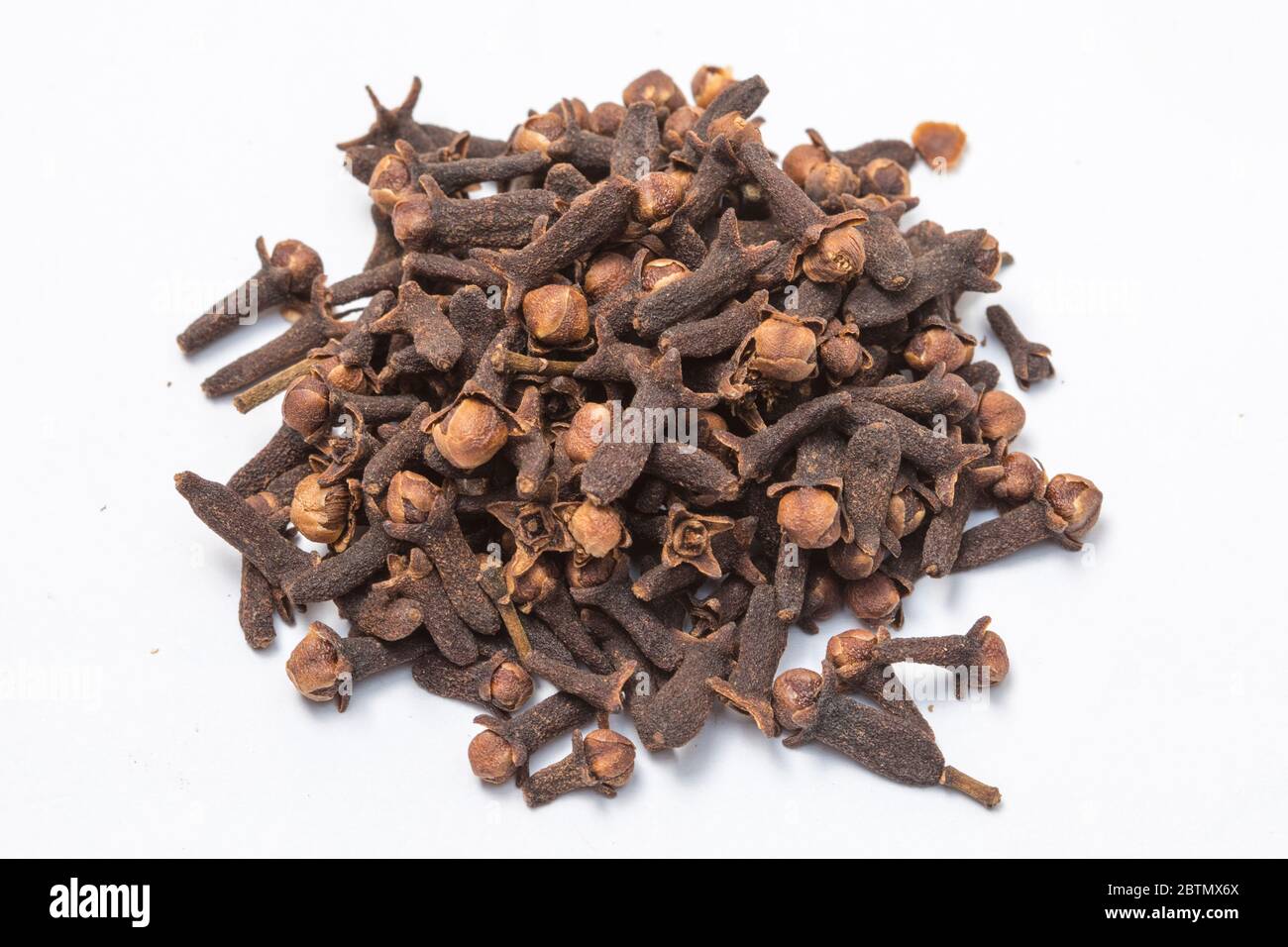 Dried cloves on white background Stock Photo - Alamy