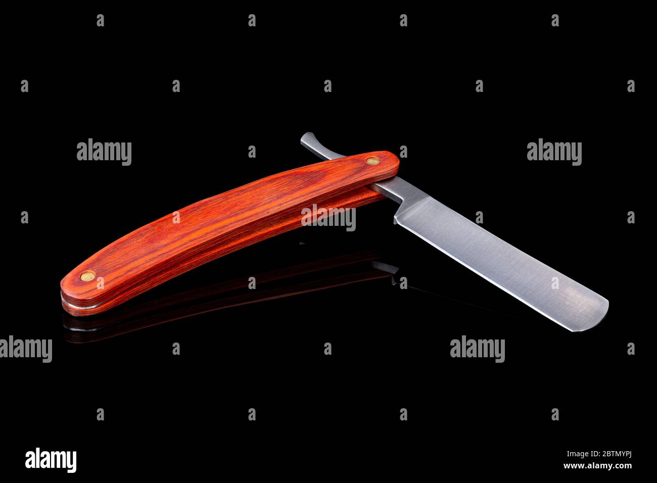 Gentlemans Traditional Cut-Throat Razor on Black Background Stock Photo ...