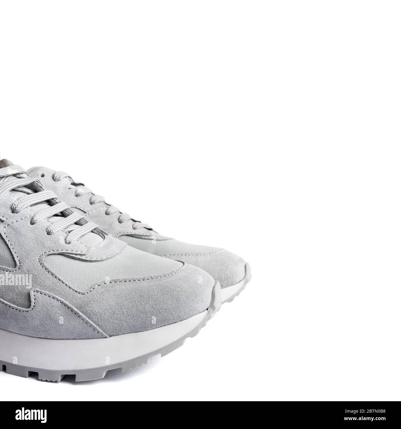 Gray sneakers isolated on white background Stock Photo - Alamy