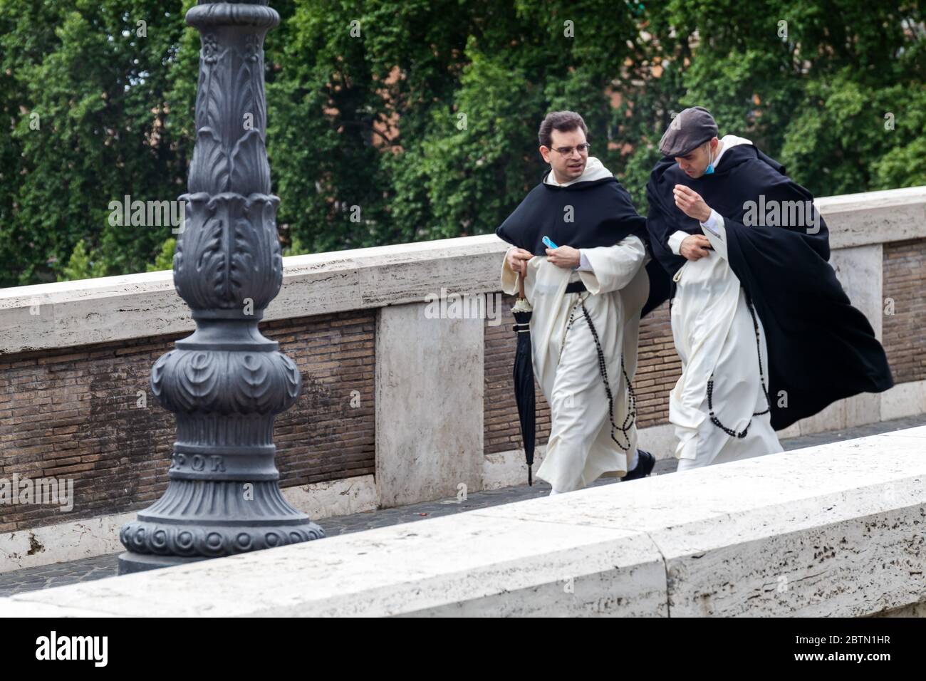 Rome, Italy - May 20, 2020: Two monks in cassock of the circestense ...