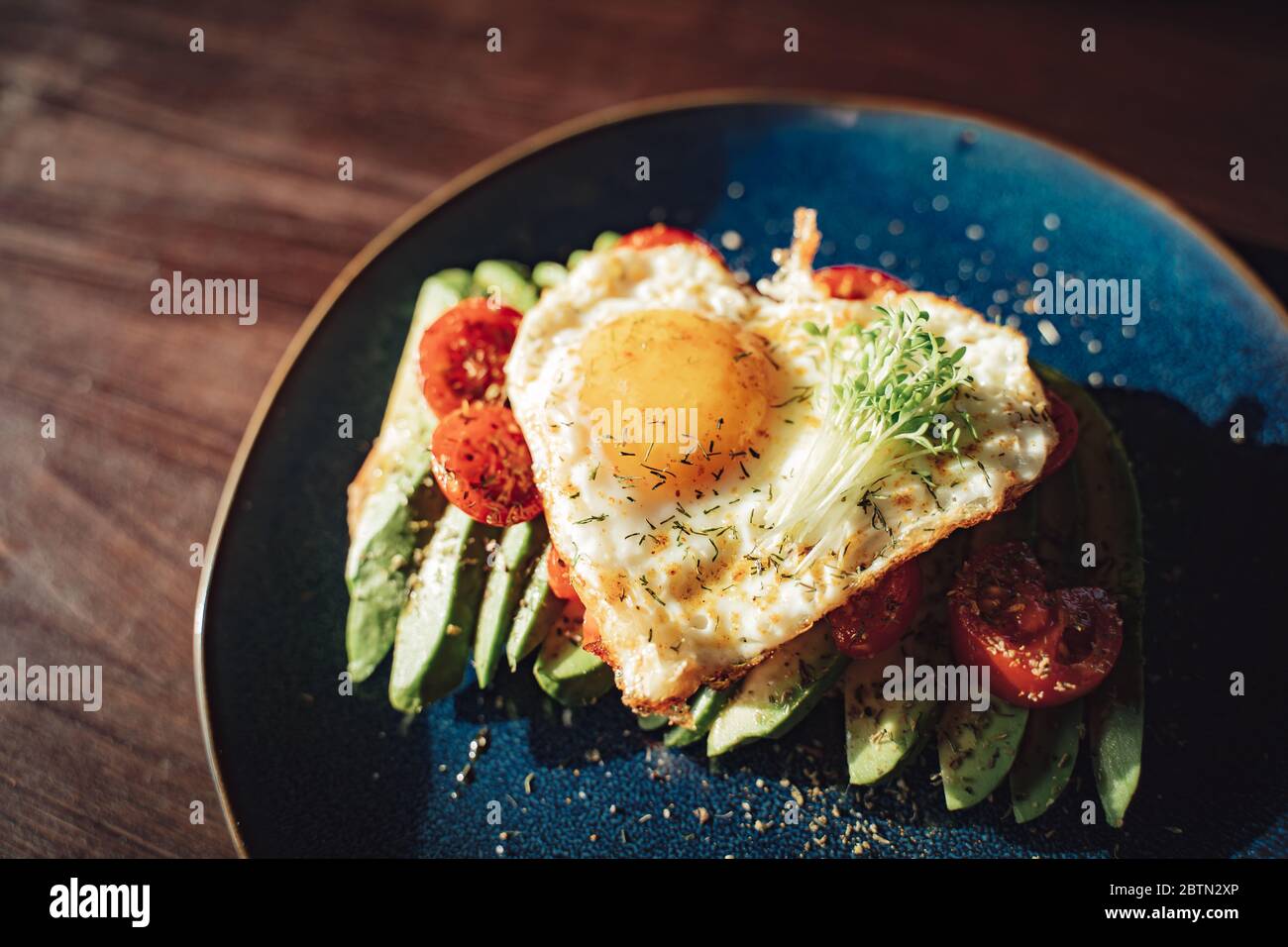 Heart shaped fried egg for a romantic breakfast Stock Photo - Alamy