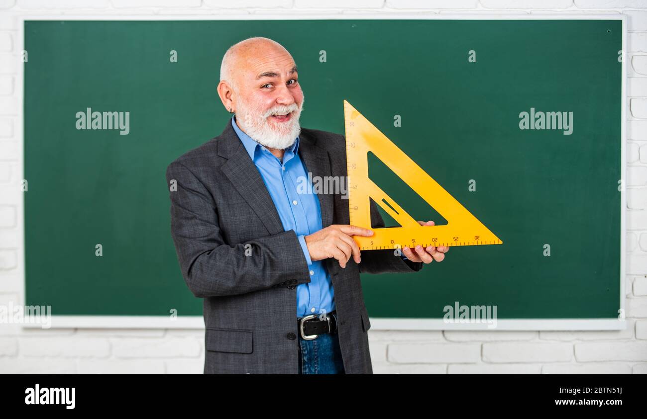 Understanding. bearded tutor man at blackboard. back to school. Math ...