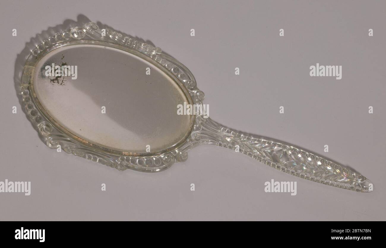 Hand mirror from Maes Millinery Shop. Hand-held oval mirror with a ...