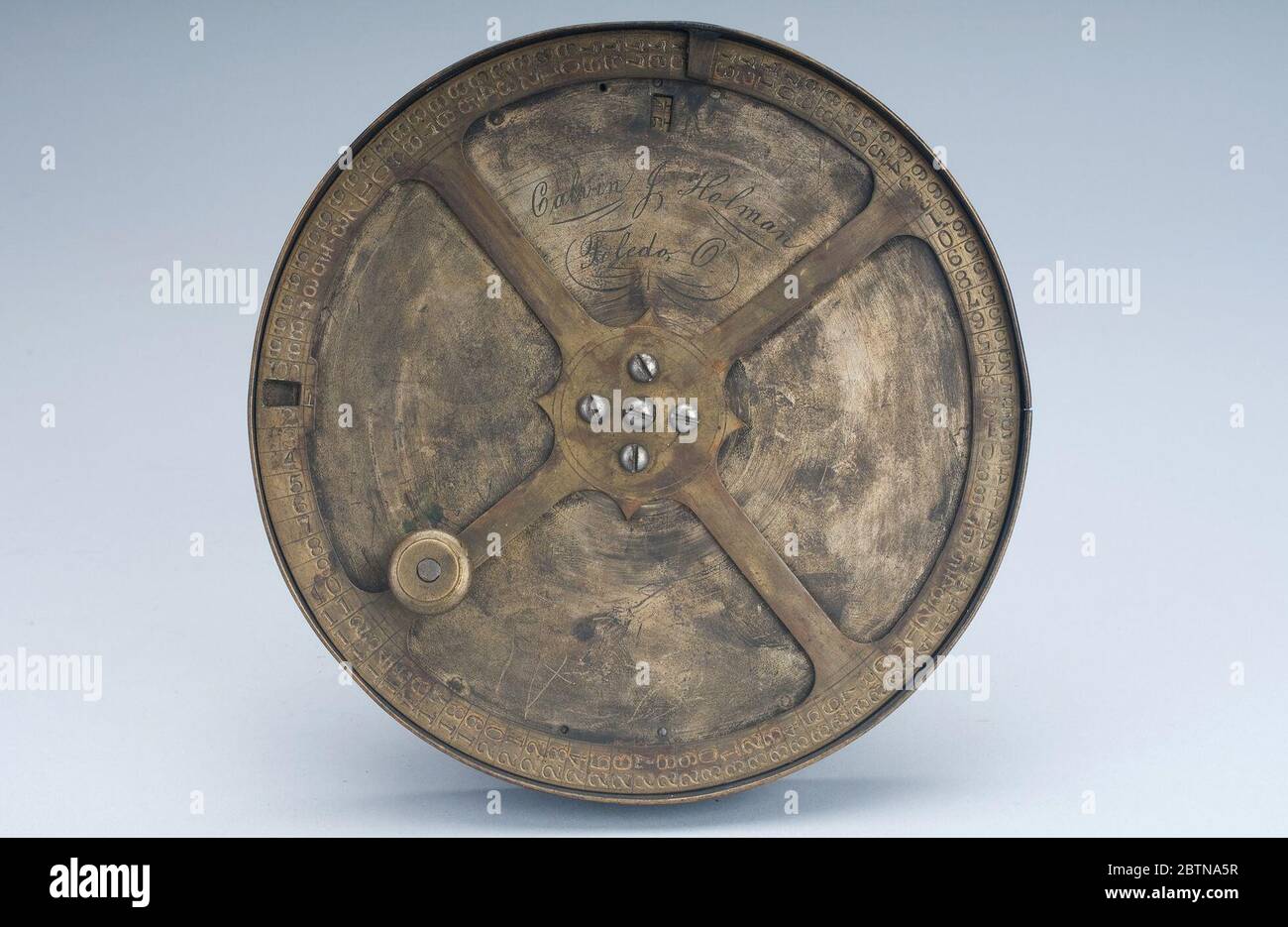 Holman Adding Machine. This round metal patent model for an adder with ...