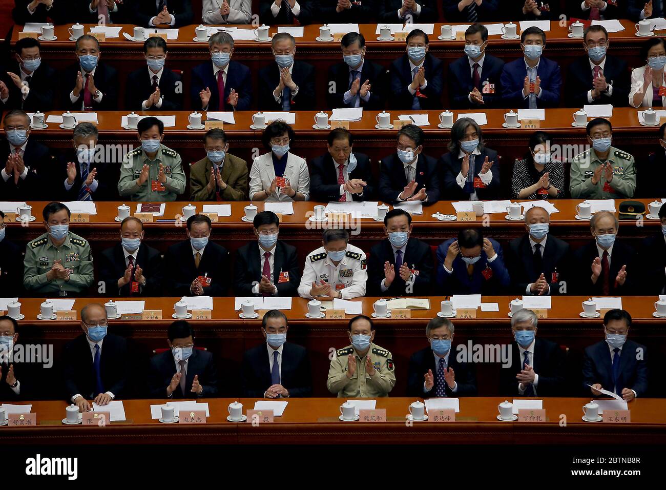 Beijing, China. 27th May, 2020. China's top leaders and delegates clap ...
