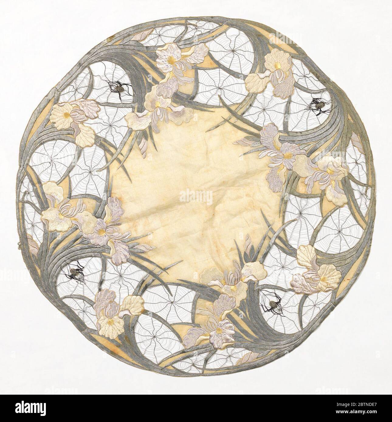 Tablecloth. Round tablecloth has embroidery and cutwork in an elaborate ...