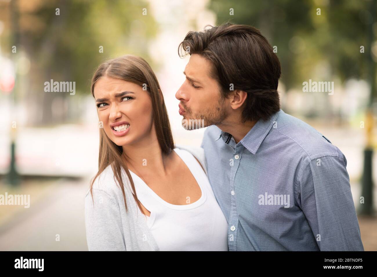 Girl Rejecting To Kiss Guy On Unsuccessful Date Walking Outside Stock ...