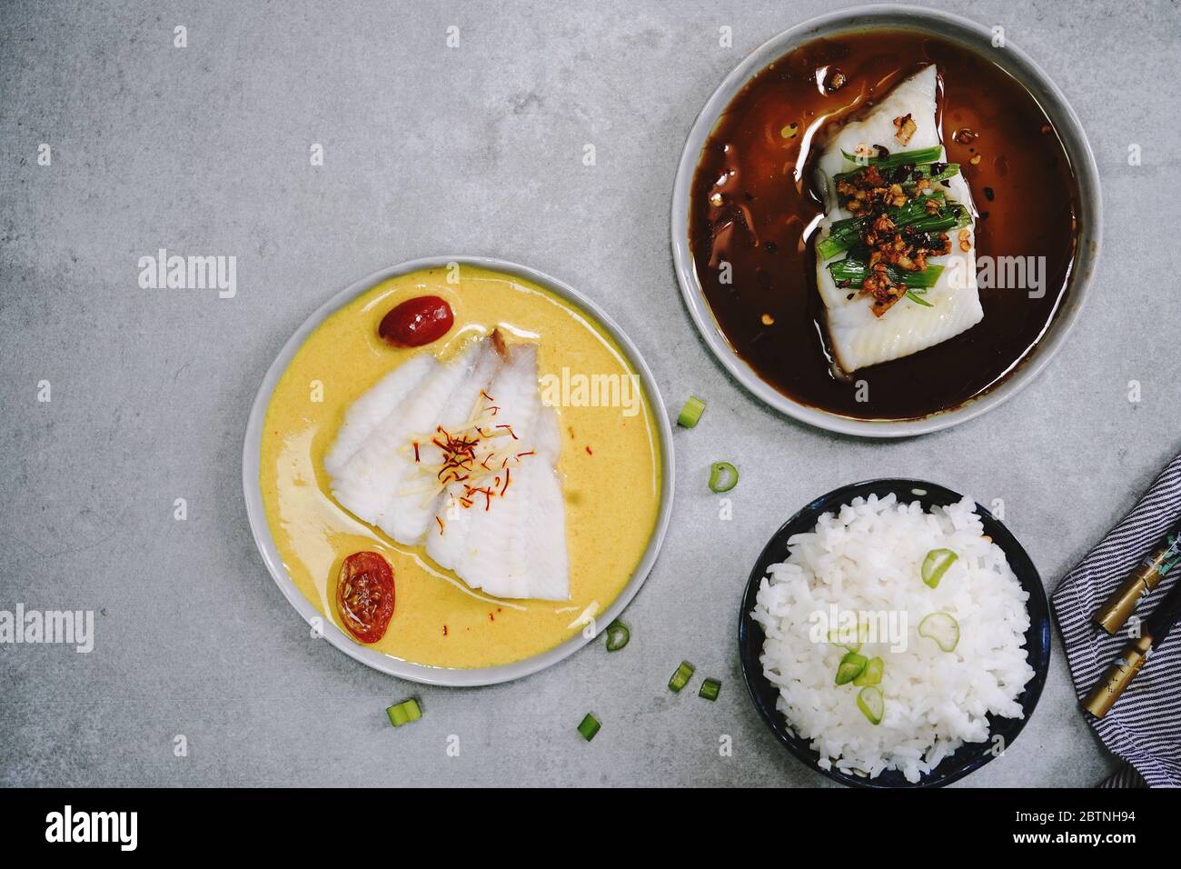 Steamed Fish Flounder in soy sauce and Curry saffron sauce, top view ...