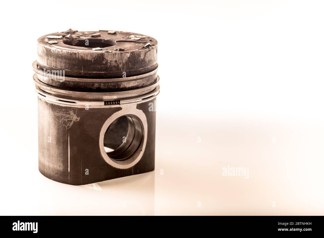 The intake valve broke and stuck in the piston Stock Photo - Alamy