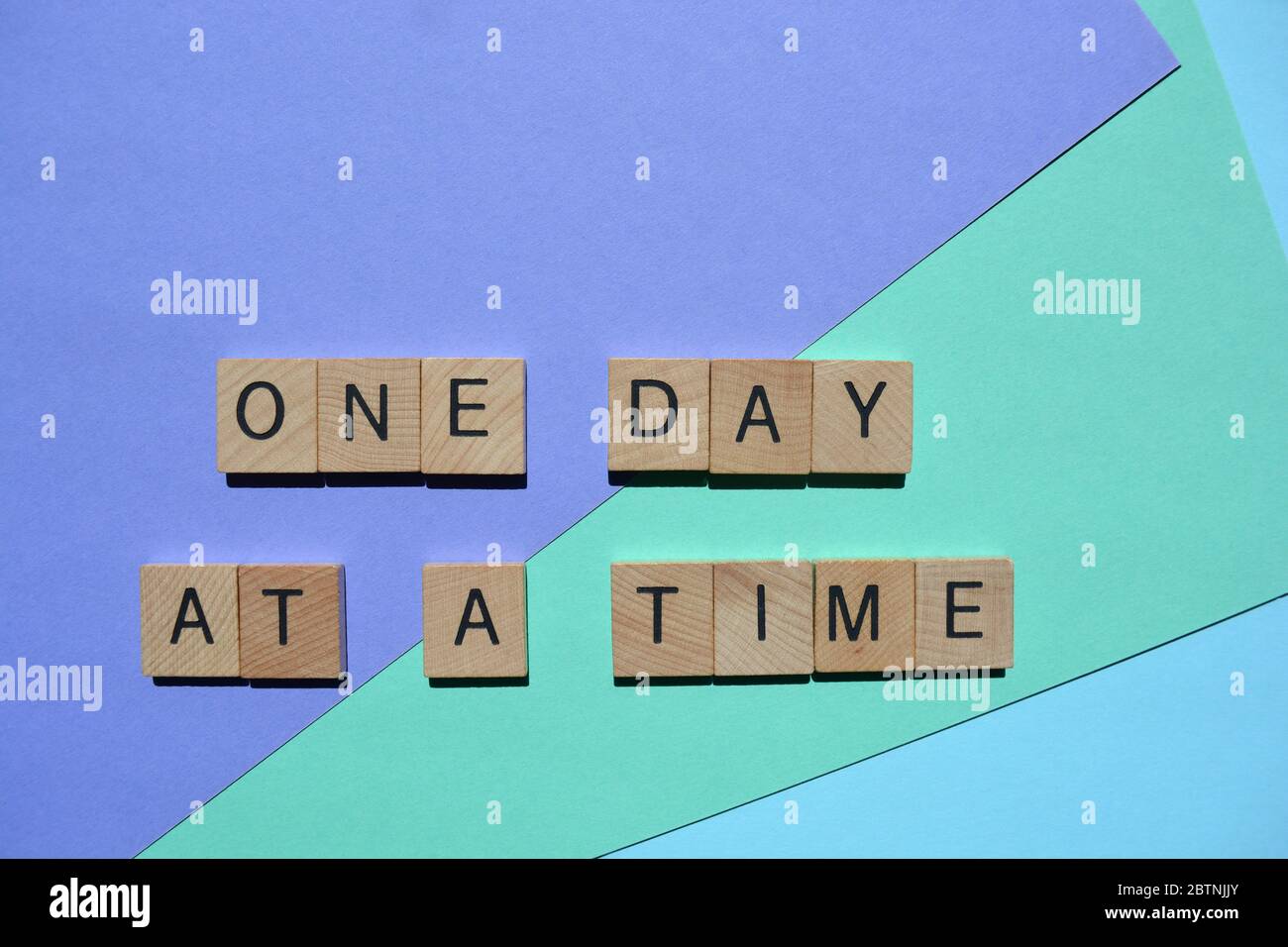One Day At A Time, words in wooden alphabet letters Stock Photo - Alamy