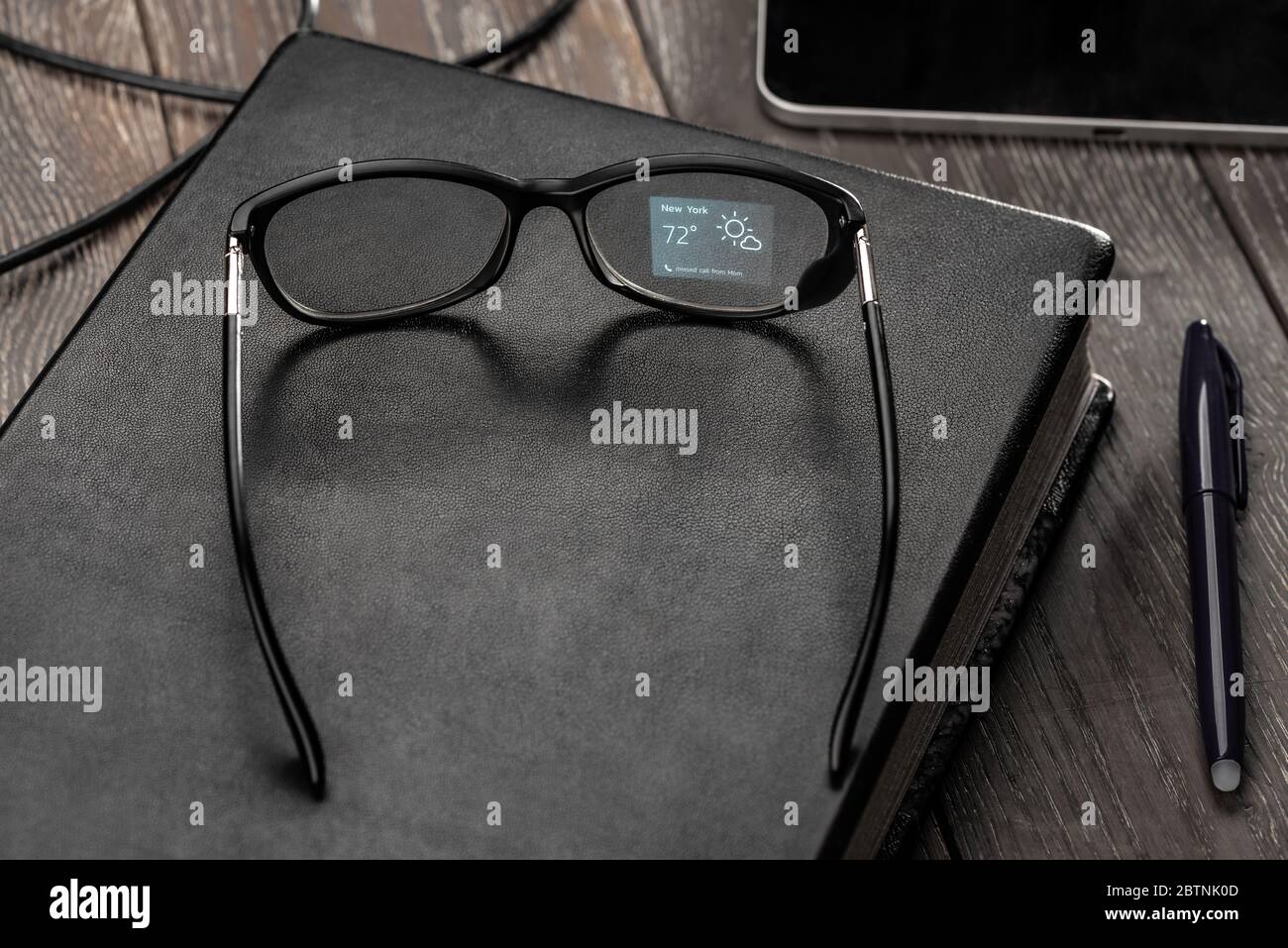 Smart glasses with weather app projected onto the lens Stock Photo - Alamy