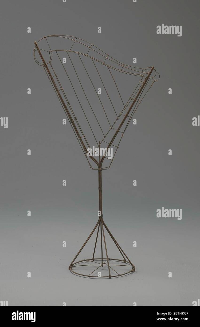 Wire frame harp on stand. The harp was a popular design for funeral ...
