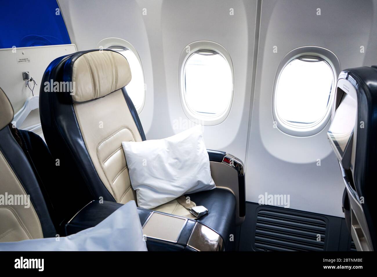 The interior of the aircraft. Empty airplane cabin. Seats for ...