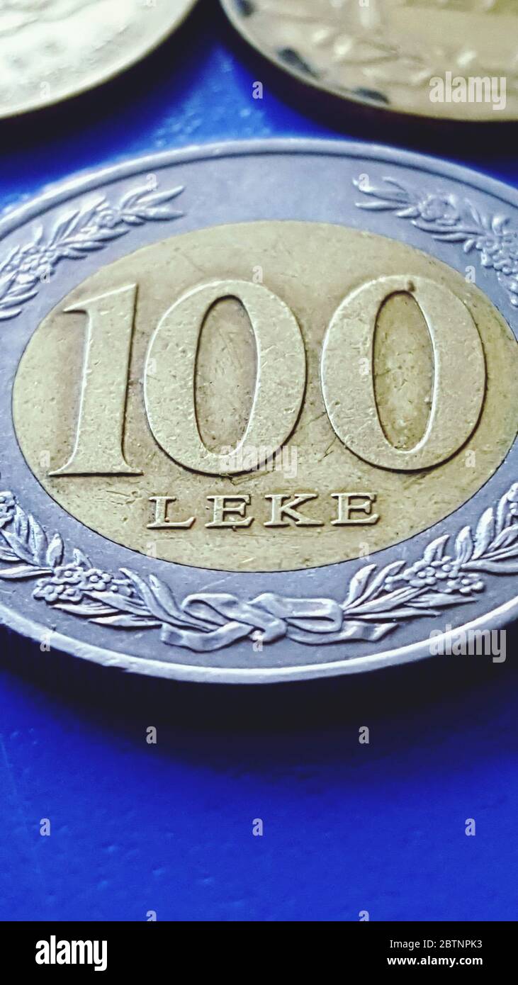 albanian lek coin on blue background Stock Photo - Alamy