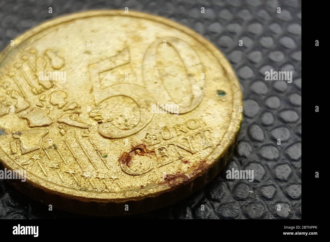 dirty and dusty coin on black background.euro cent Stock Photo - Alamy