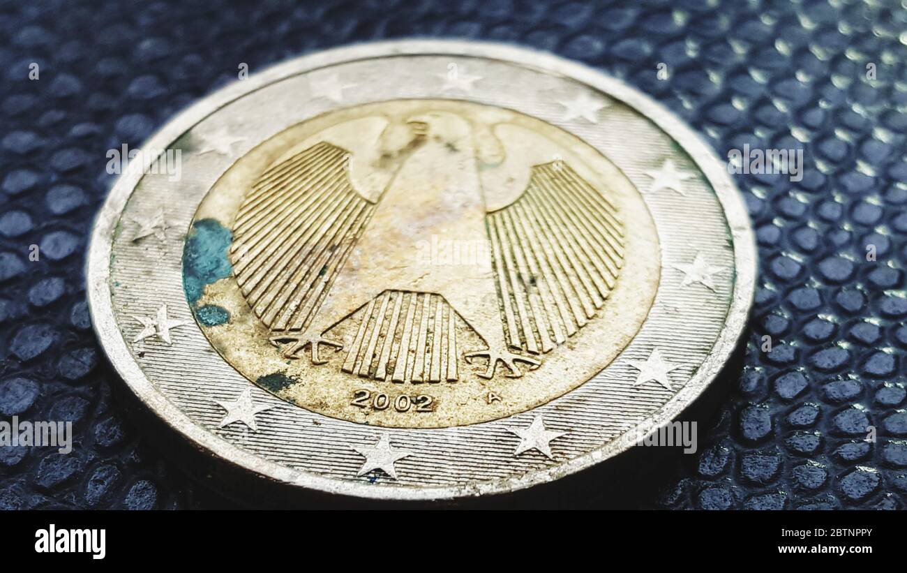 dirty and dusty coin on black background Stock Photo - Alamy