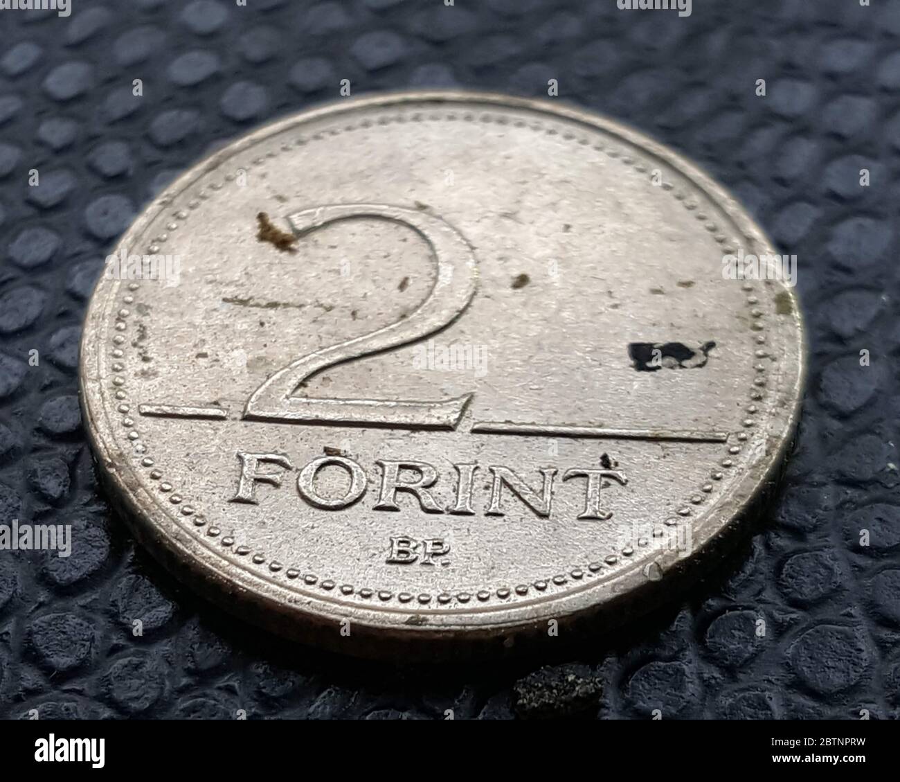 dirty and dusty coin on black background,hungary money Stock Photo - Alamy