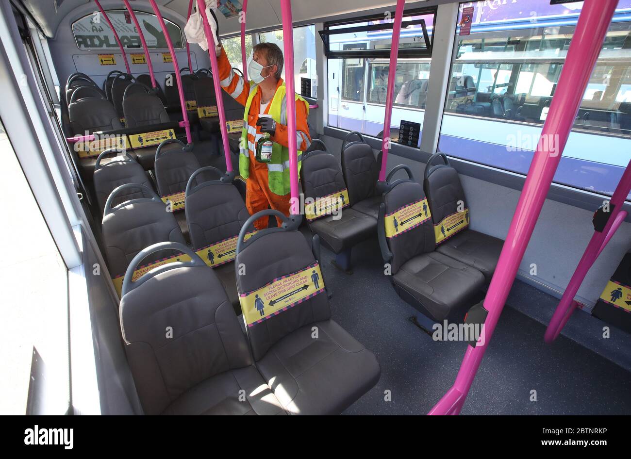 Cleaner James York from First Bus cleans a bus at their Larbert depot ...