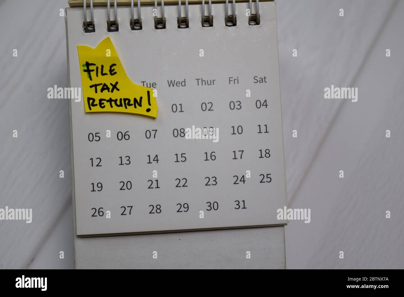 File Tax Return text on monthly Calendar isolated on office desk Stock ...