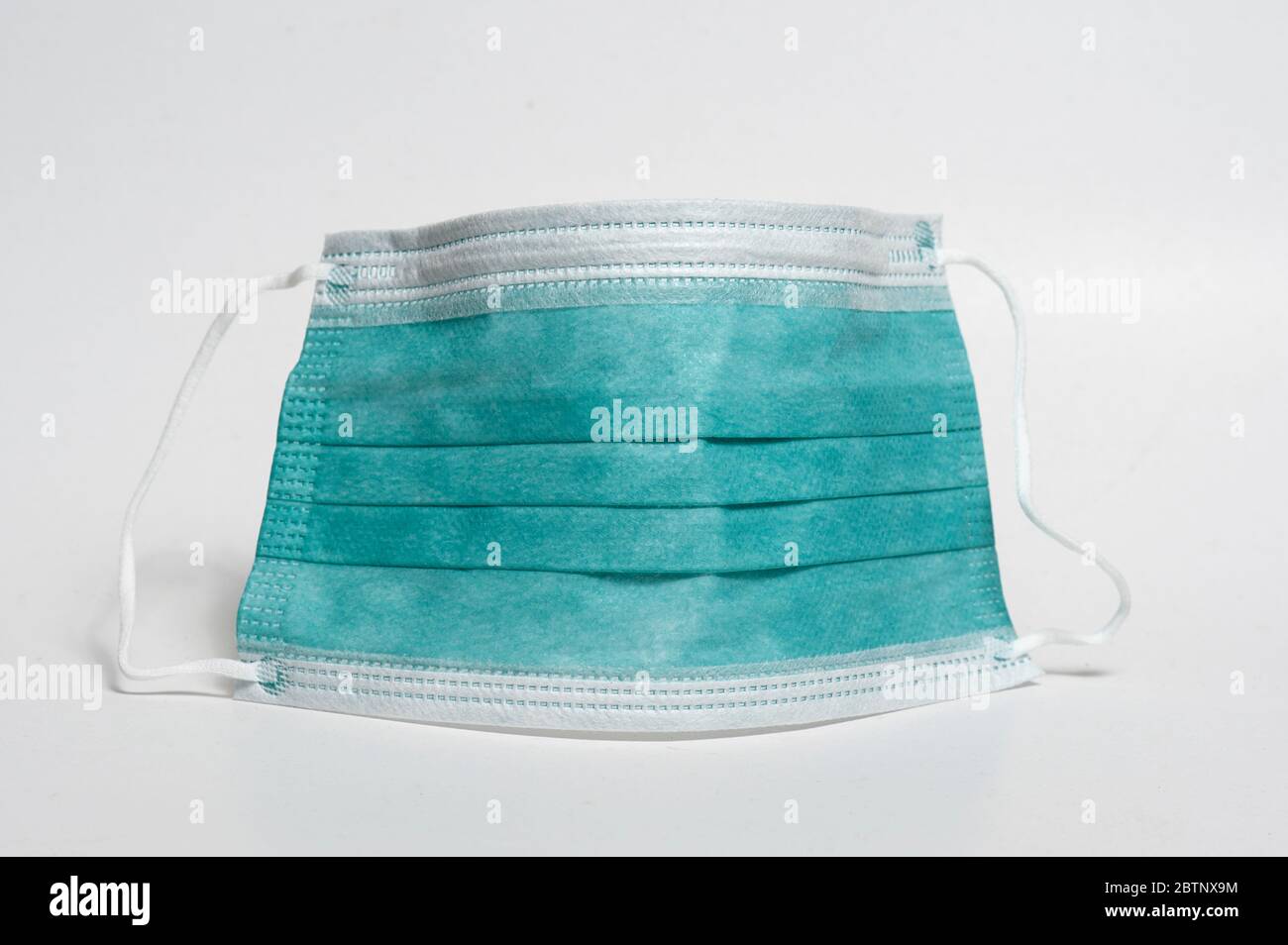 surgical mask on white background Stock Photo - Alamy