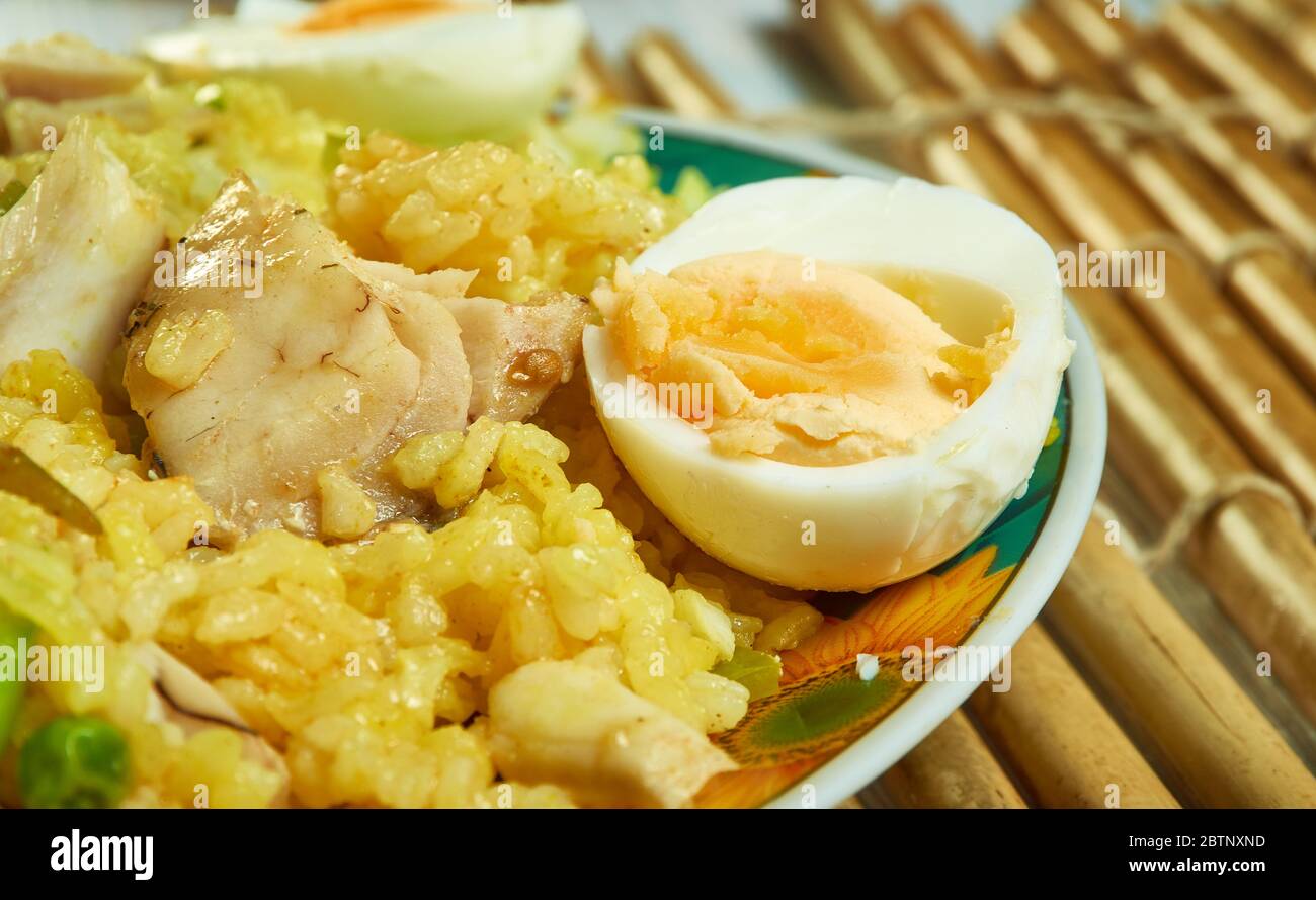 Smoked Spanish paprika paella with cod close up Stock Photo - Alamy