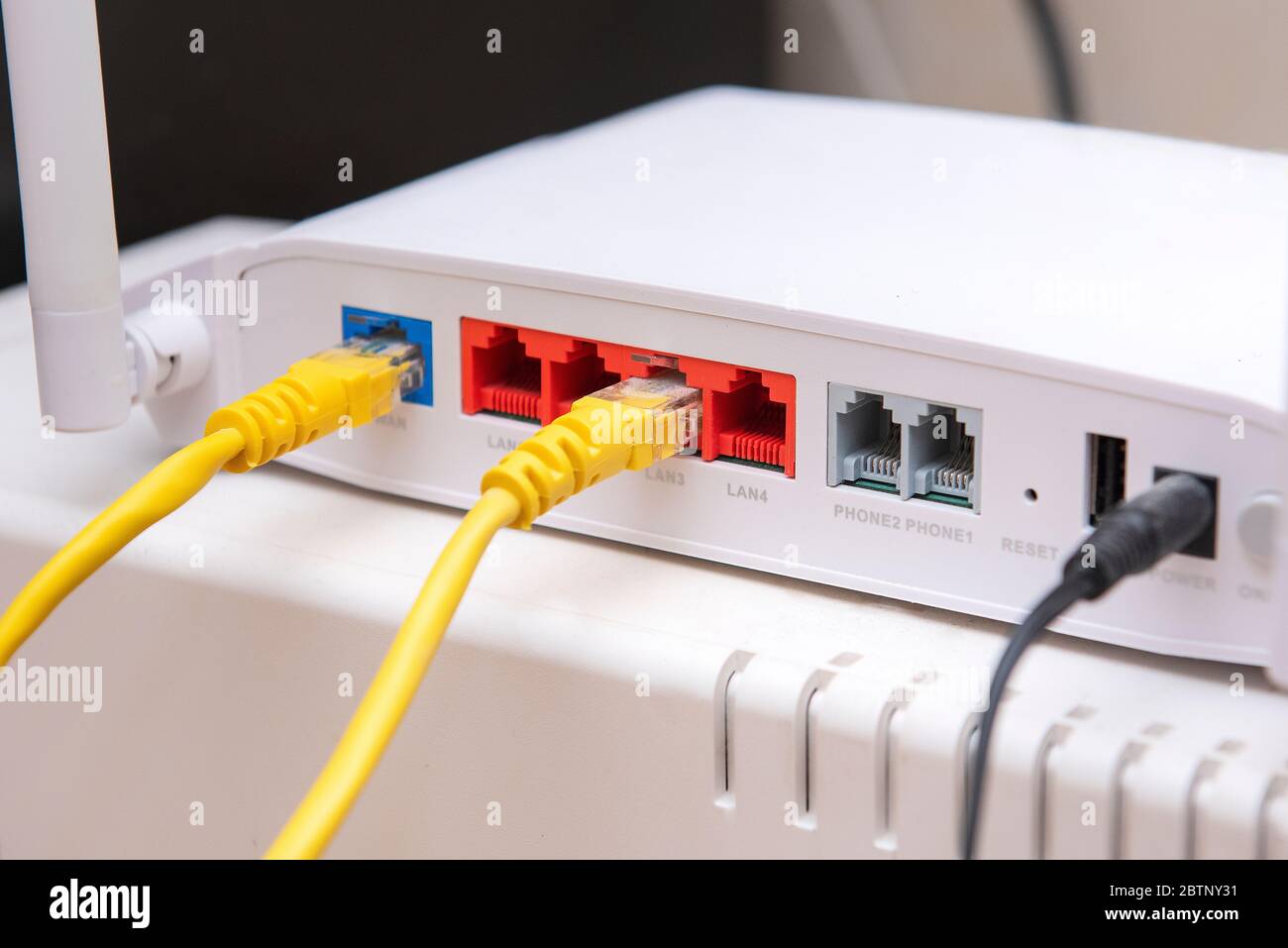 white router includes two yellow cable connectors rg45, home route ...