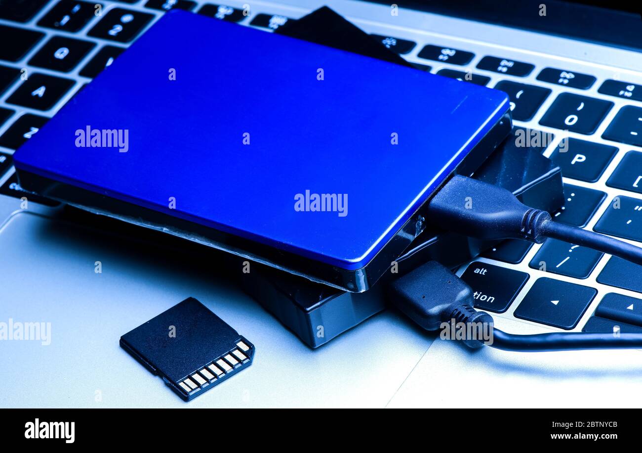 External disk hard drive connected to notebook Stock Photo - Alamy