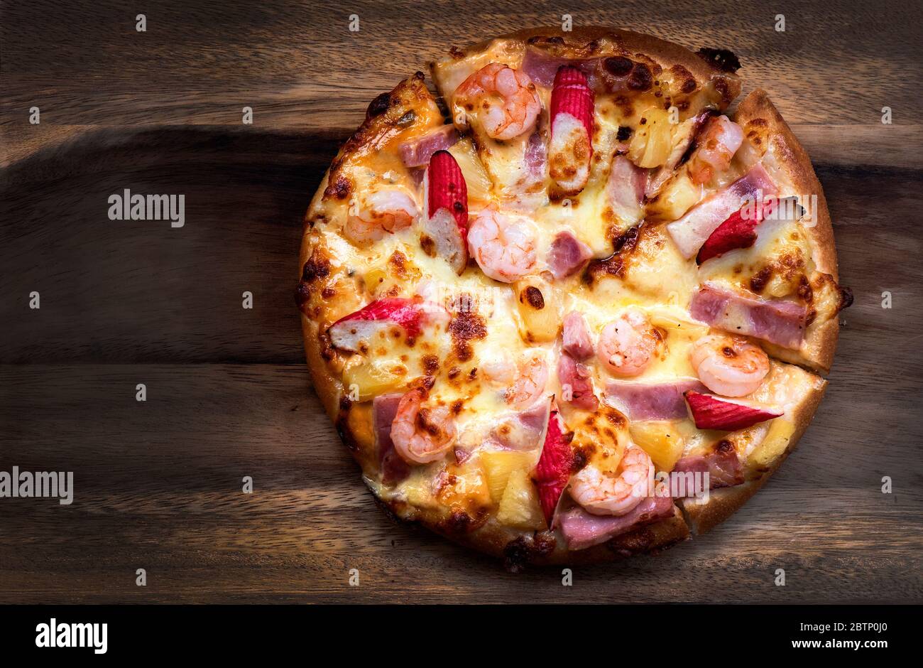 Flat lay Pizza pepperoni, mozzarella, oregano on a wood background ...