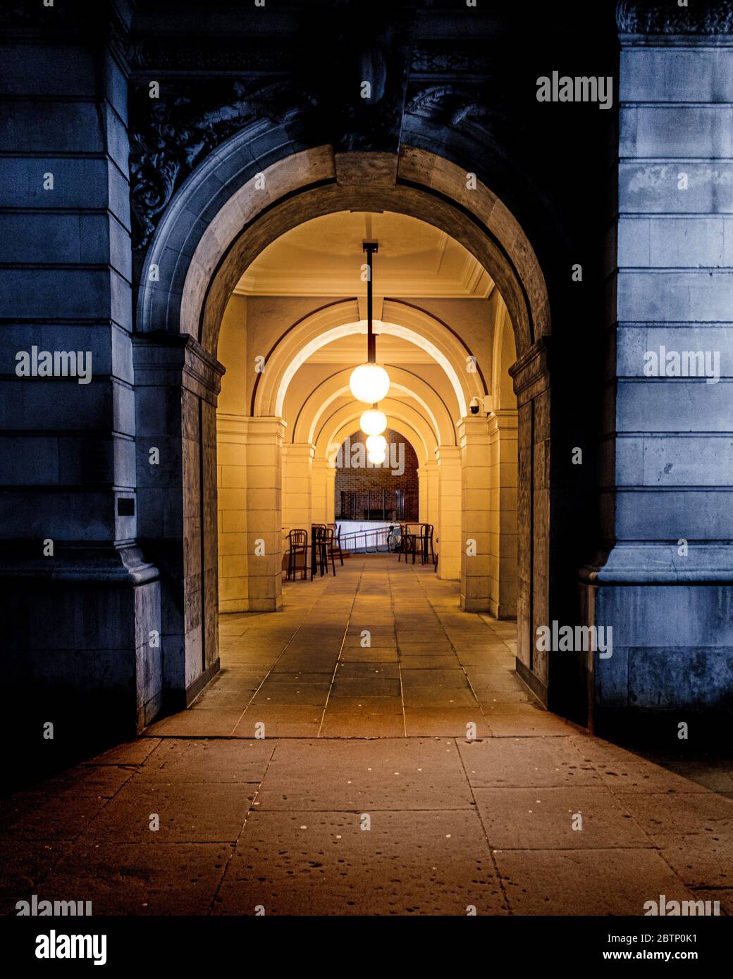 An archway lit by spherical white lights Stock Photo - Alamy