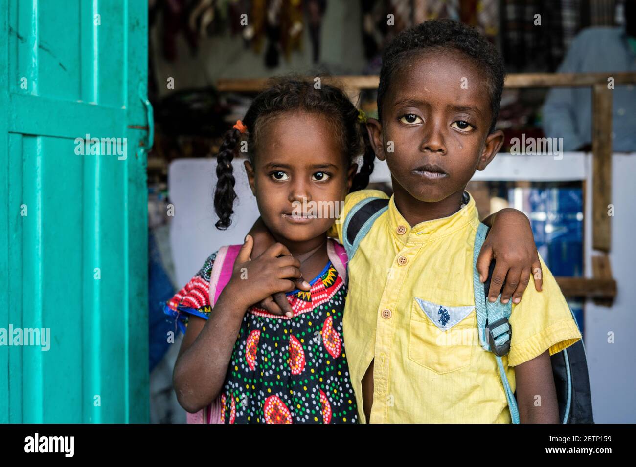 Portrait of cute little boy and girl standing close, Asaita, Afar ...