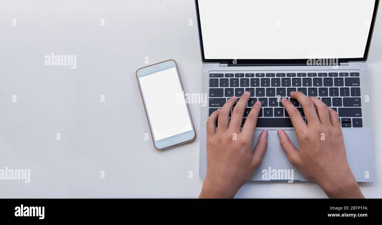 Flat lay man pushed the keyboard with a notebook computer on white ...